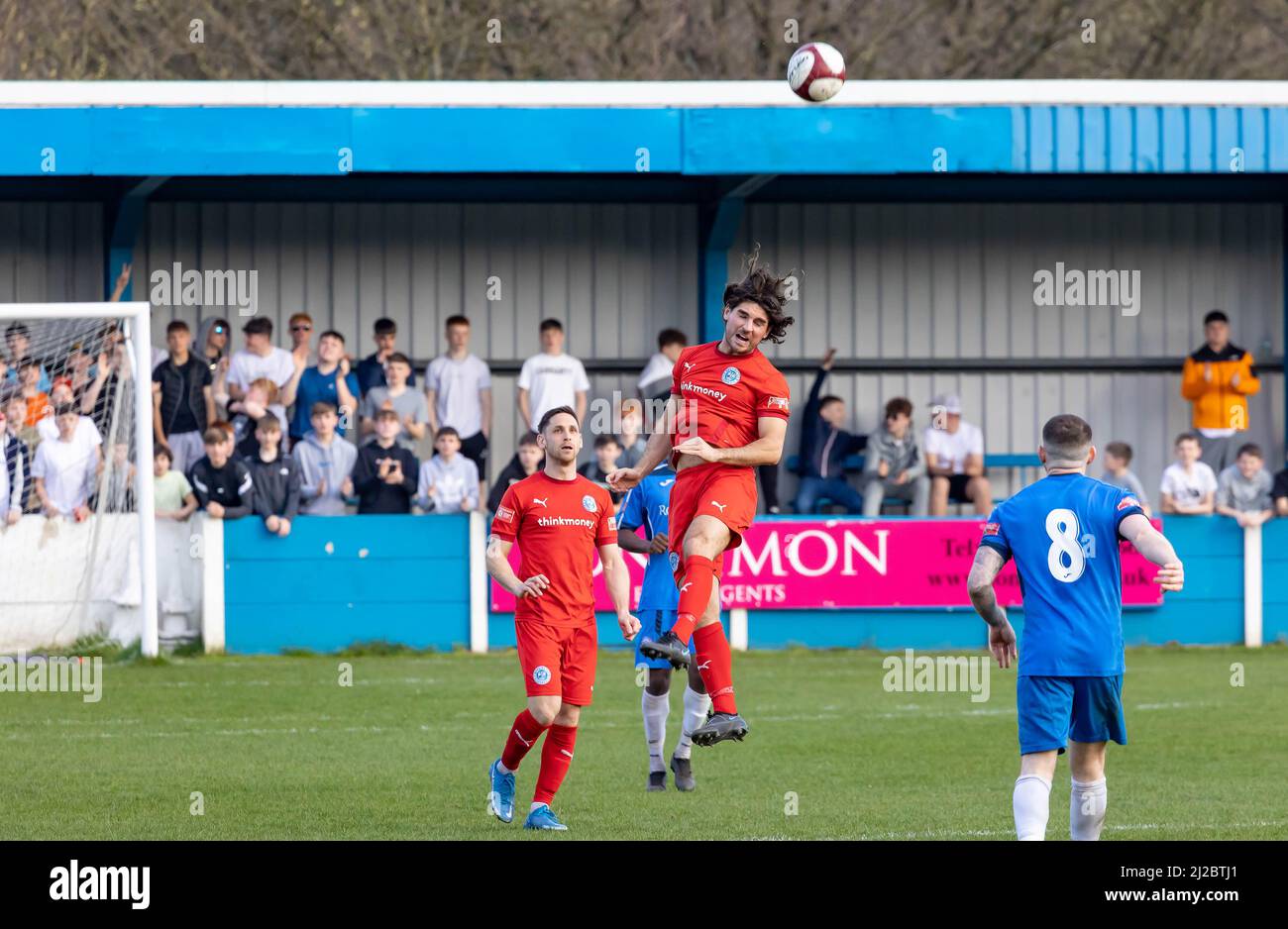 Rylands player Charlie Doyle jumps high for a midfield header against ...