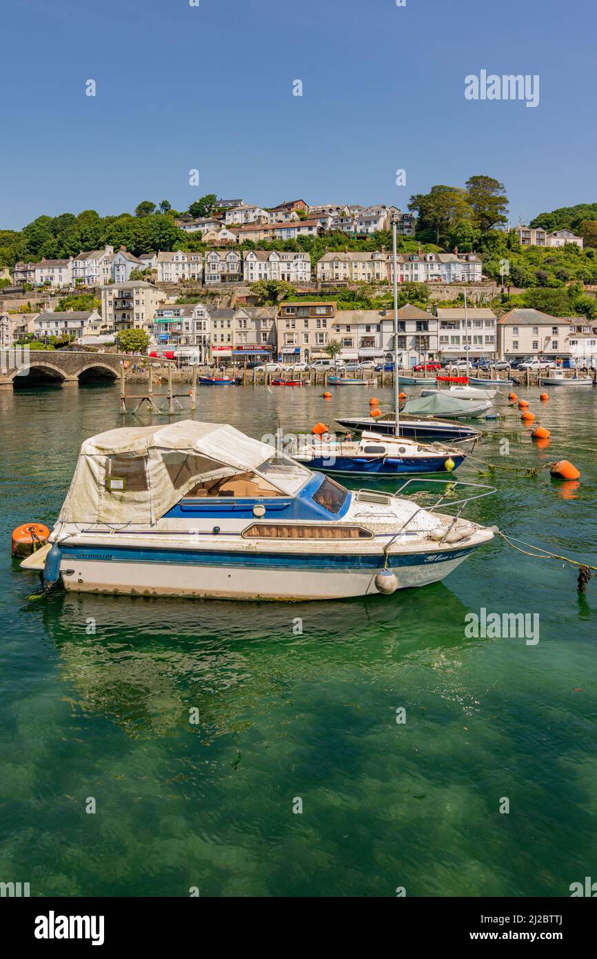 Looking over the East Looe River to East Looe dwellings and shops on a ...