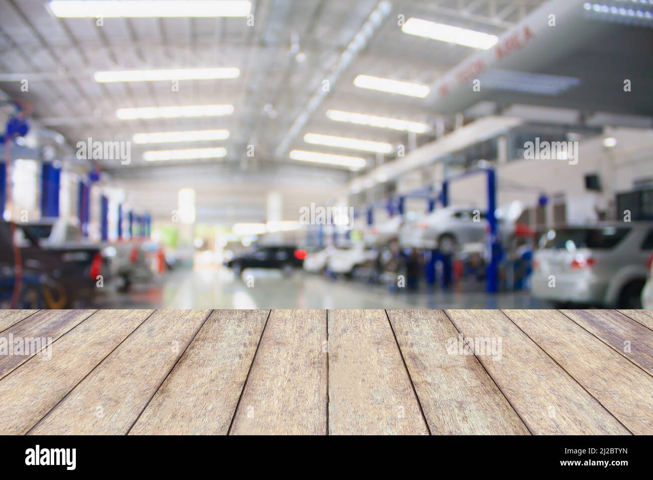 Wood table top with blur garage background, for product display or ...