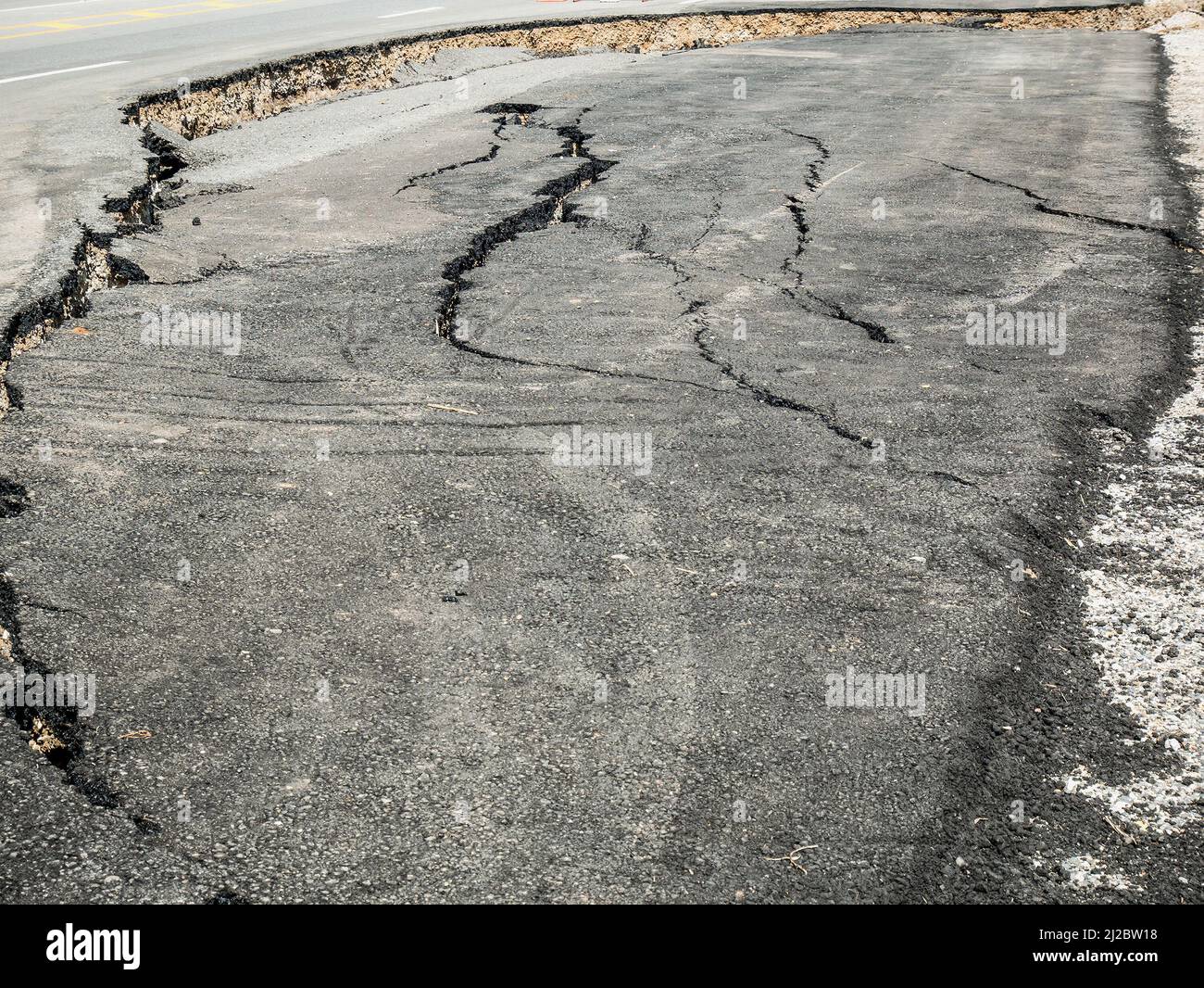 asphalt road cracked and broken texture Stock Photo - Alamy