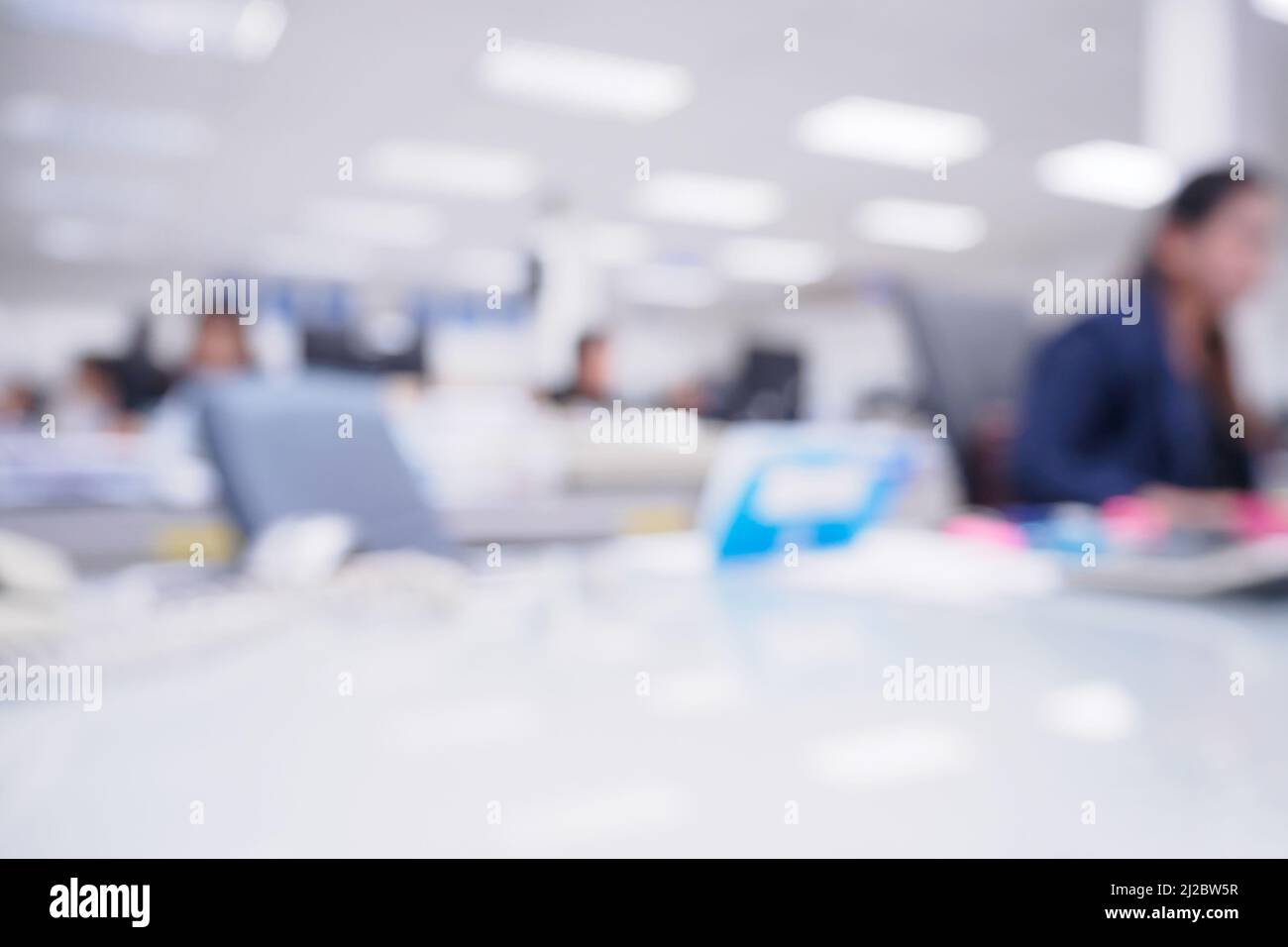 office blurred background with people working at desk Stock Photo - Alamy