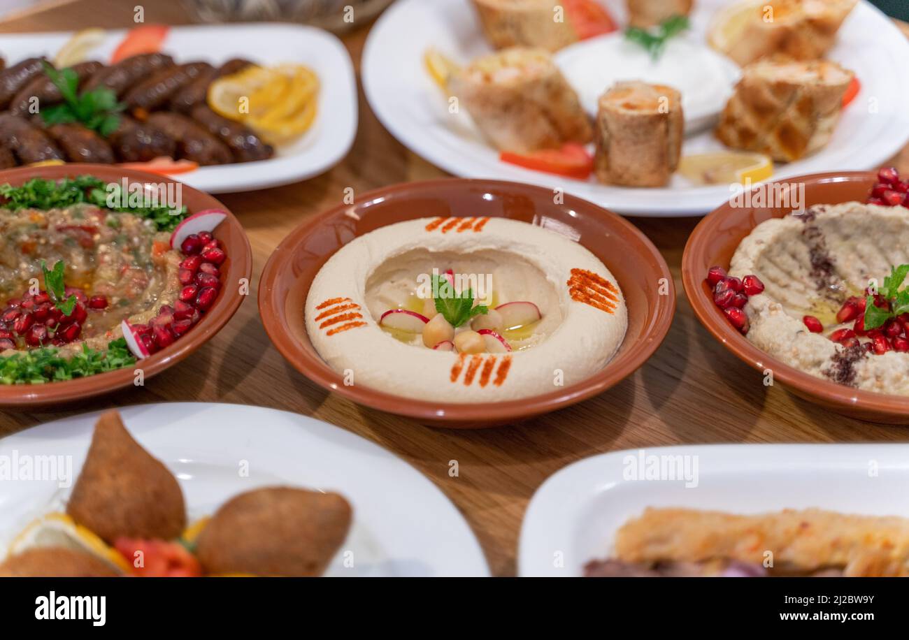 Multiple lebanese appetizers and salads togeather on the table. focused ...