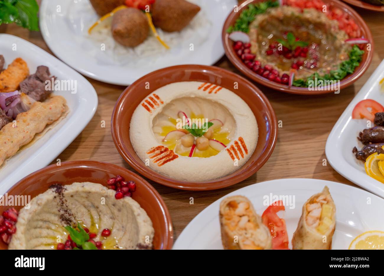 Multiple lebanese appetizers and salads togeather on the table. focused ...