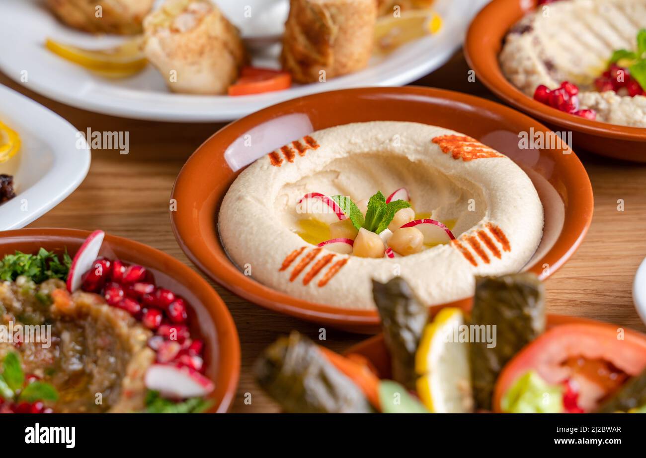 Multiple lebanese appetizers and salads togeather on the table. focused ...