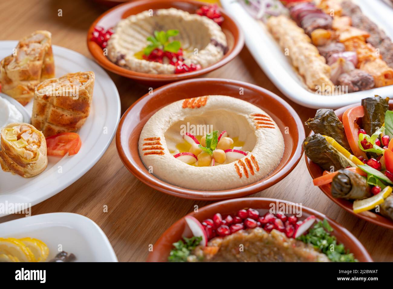 Multiple lebanese appetizers and salads togeather on the table. focused ...