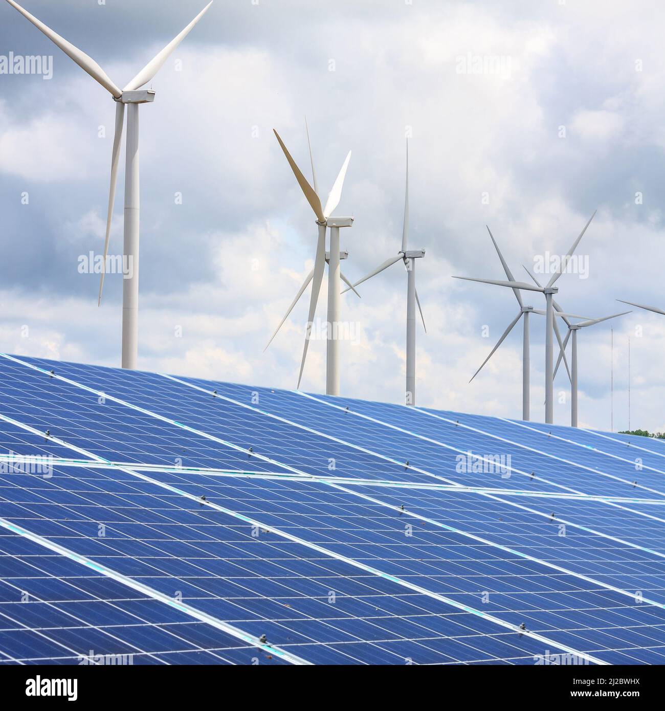 Wind turbines and solar panels with the clouds and sky, renewable ...
