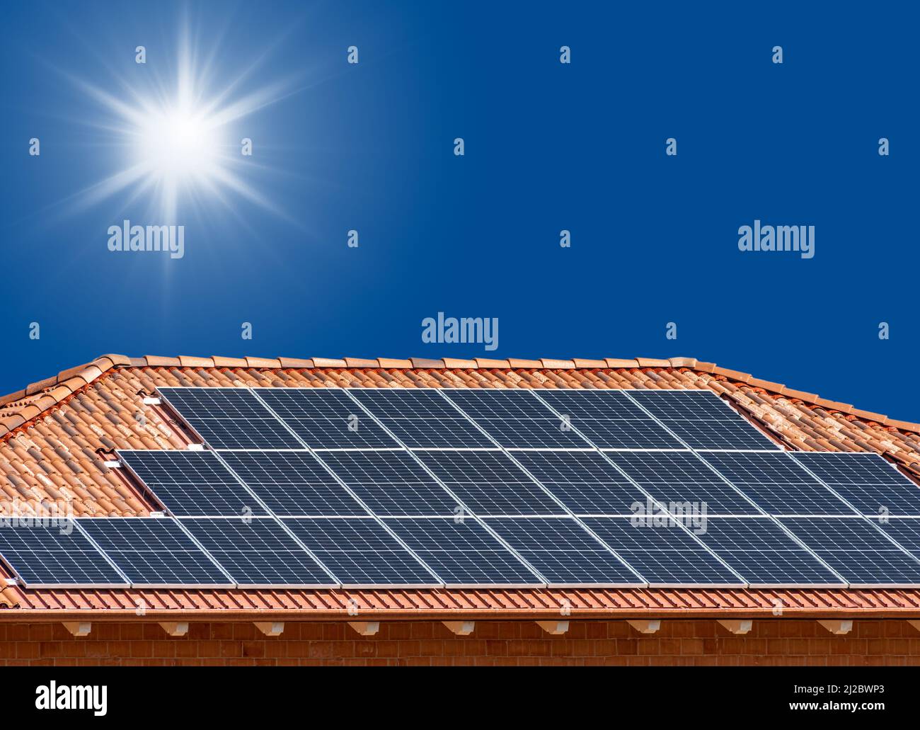 Roof with solar panels on blue sky with sun rays, copy space Stock ...