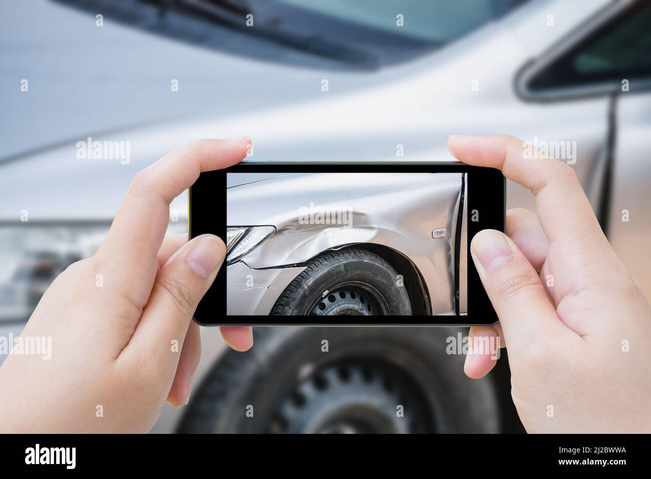 woman using mobile smartphone take photo car crash accident of the ...