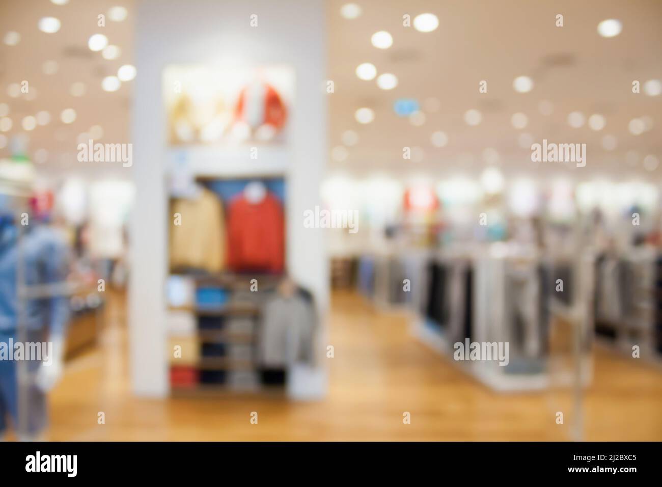 clothing boutique store interior blurred background Stock Photo - Alamy