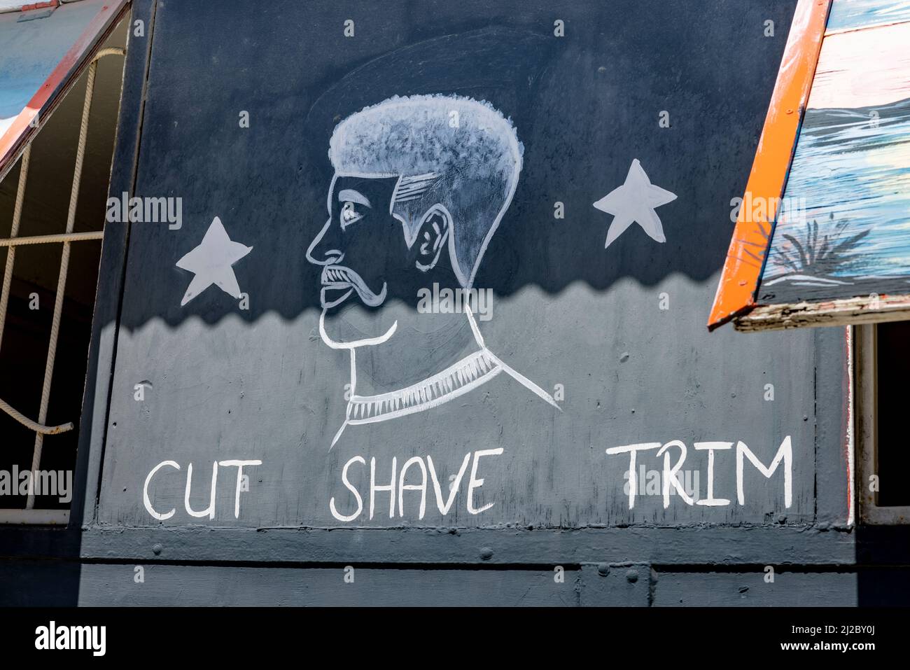 Barbershop in a booth in the streets of Willemstad, Curacao Stock Photo ...