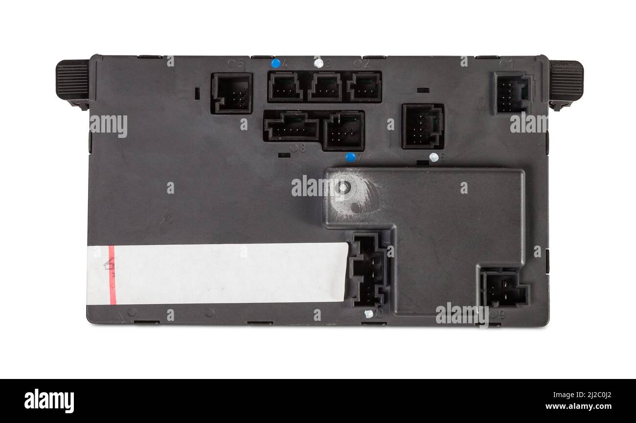 Plastic car engine control unit with metal elements on a white isolated ...