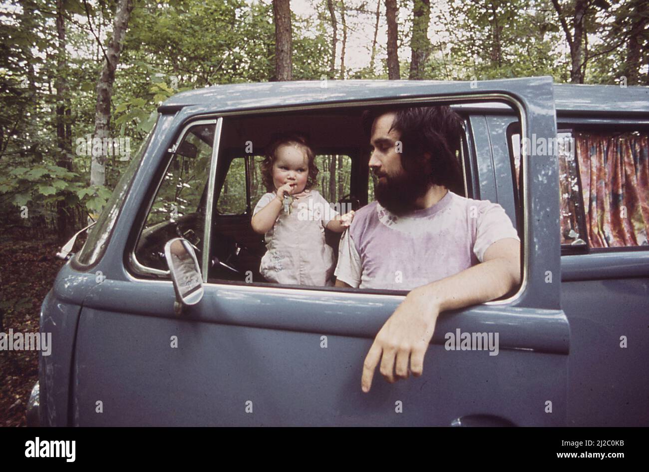 Man with beard and his daughter in a Volkswagen van ca. 1972 Stock ...