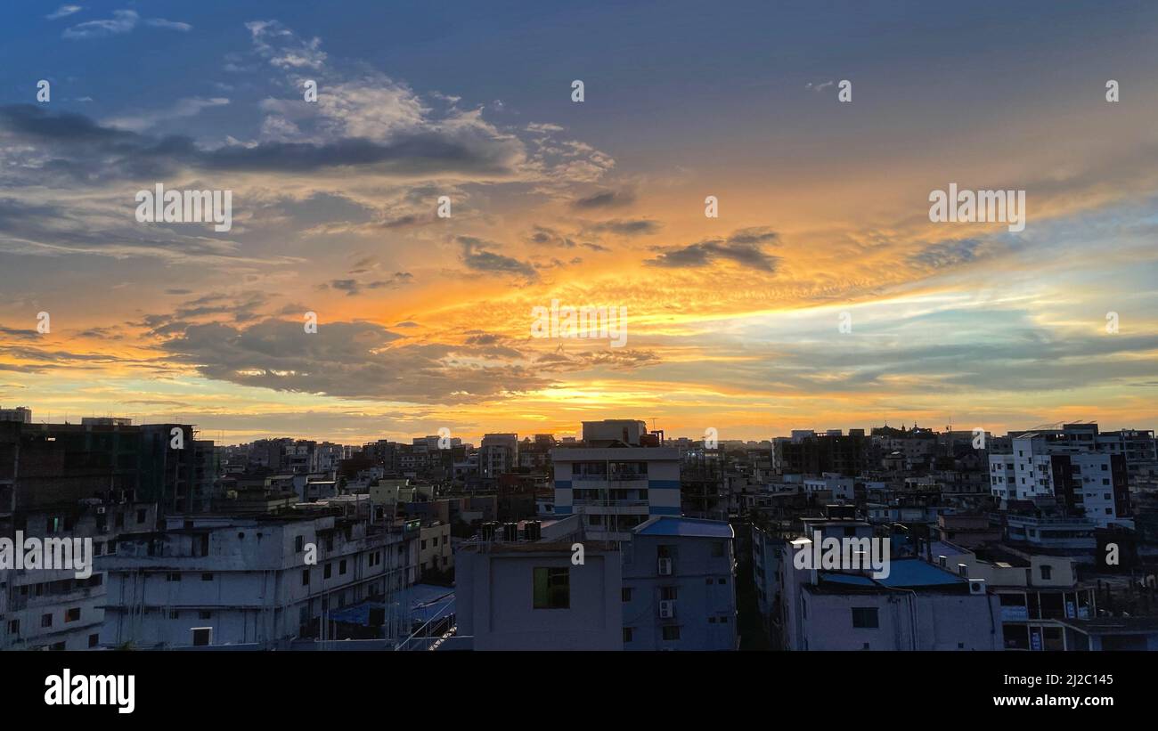 An aerial view of city buildings under sunset sky Stock Photo - Alamy