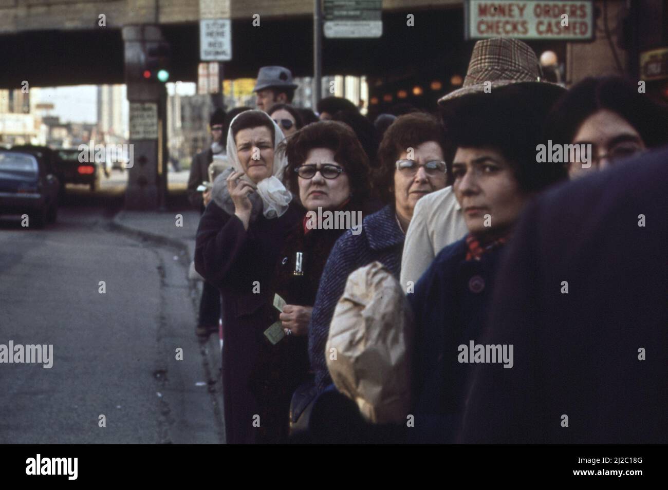People queuing up for the bus at a CTA bus stop in Chicago ca. 1973 ...