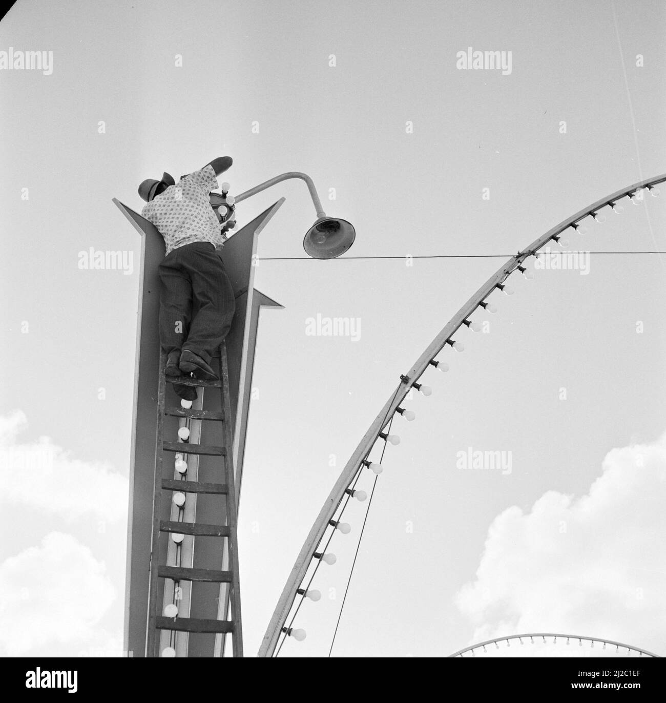 Decorating the Emma Bridge in Willemstad ca. October 1955 Stock Photo ...