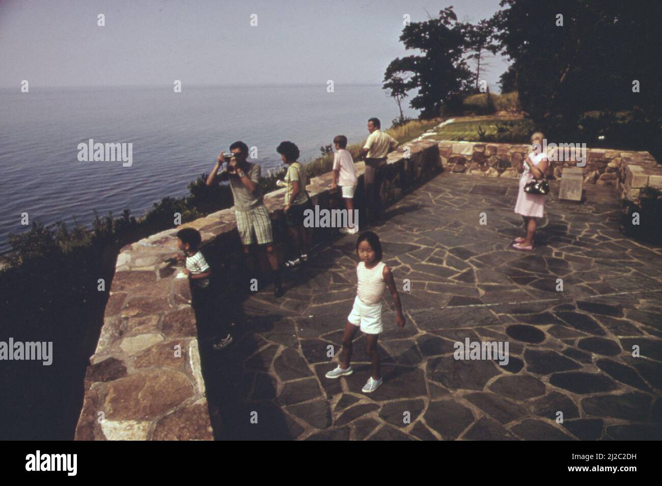 Tourists view Lake Michigan from landscaped visitors' area ca. 1973 ...