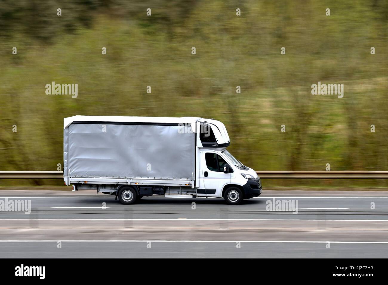 Newport, Wales - March 2022: Light goods vehicle box van driving on a ...
