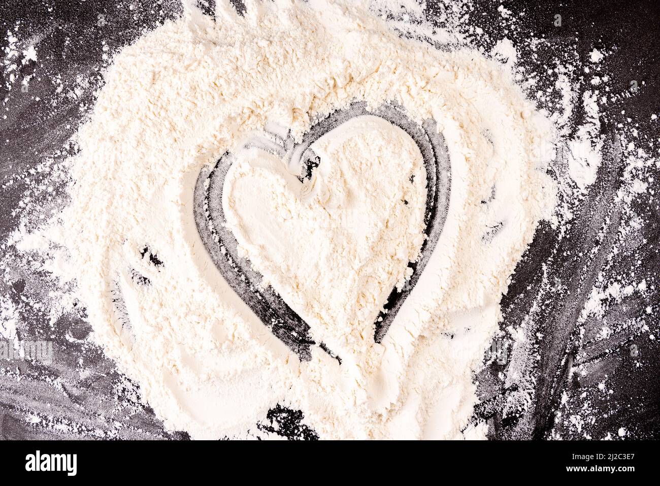 The cooking and baking process-flour heart closeup shot Stock Photo - Alamy