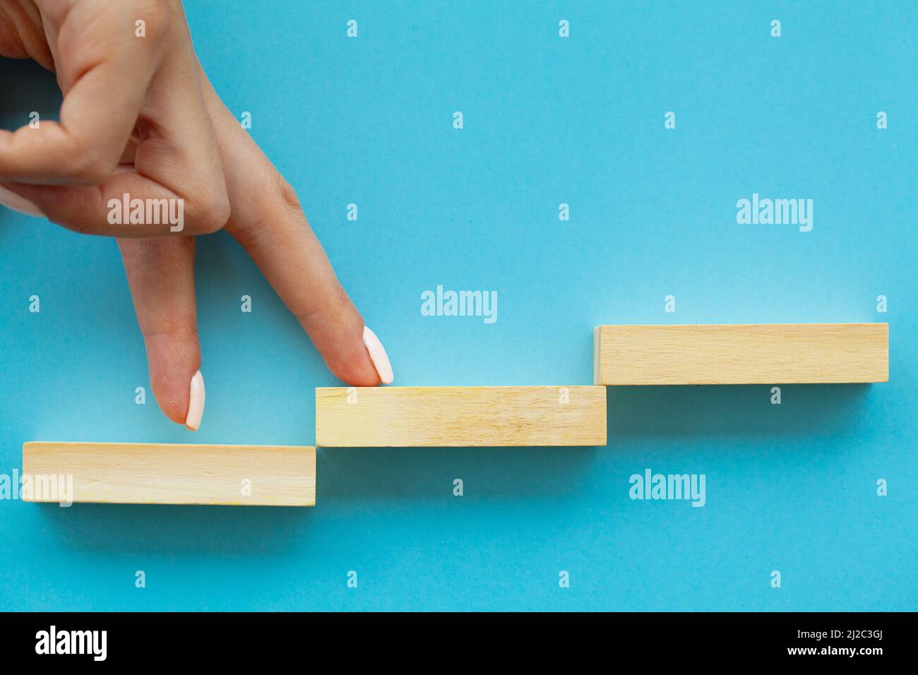 Hand arranging wood block with empty space Stock Photo - Alamy