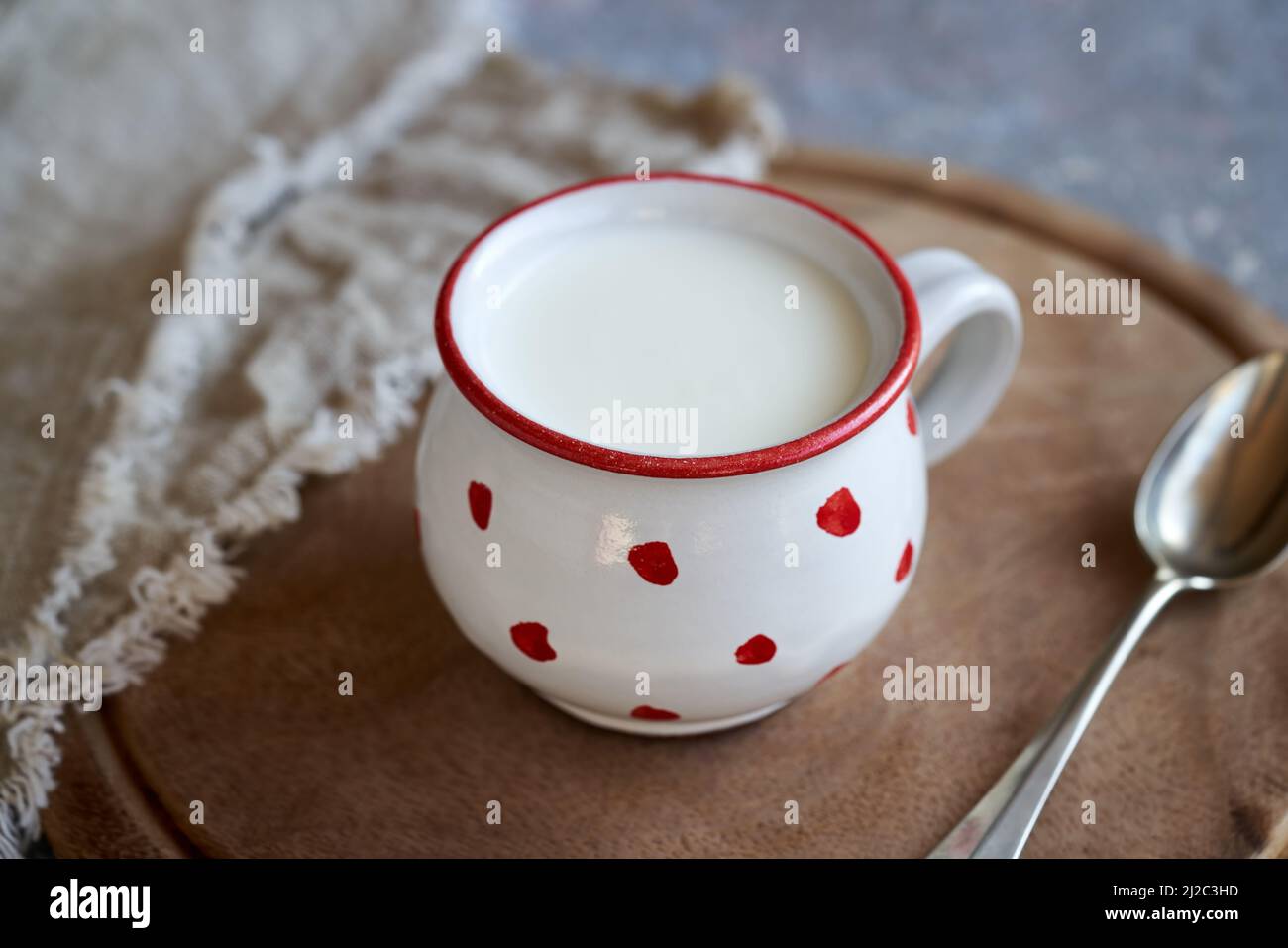 Fresh kefir in a white and red dotted cup - source of probiotics Stock ...