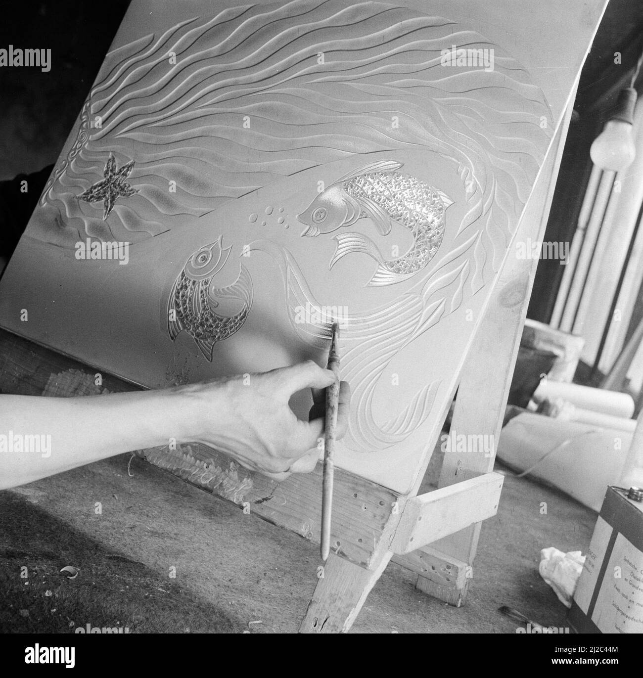 Engraving a glass panel with fish ca: 1948 Stock Photo - Alamy
