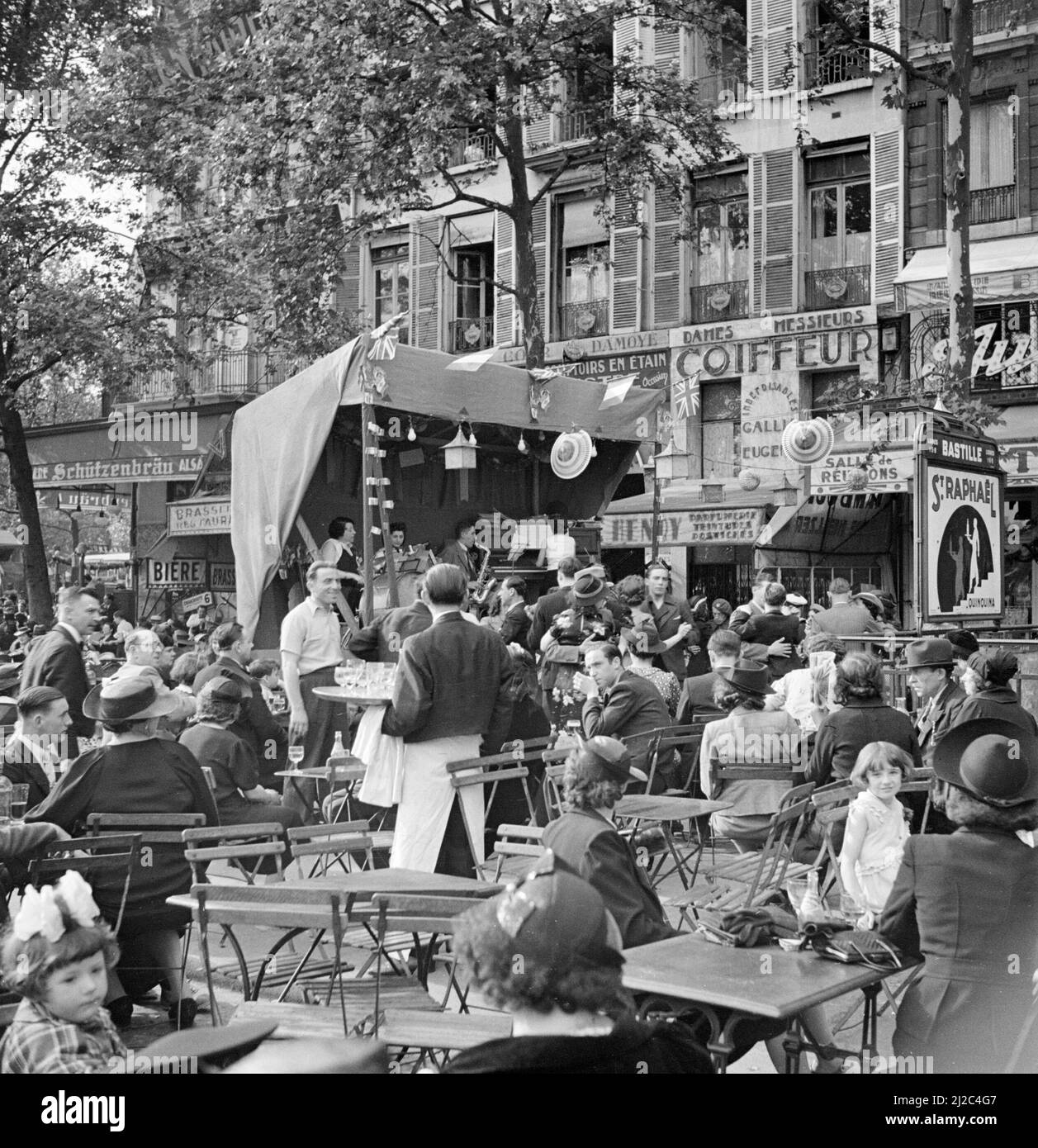 14 July 1938 Paris, people partying on Place de la Bastille. Terrace ...