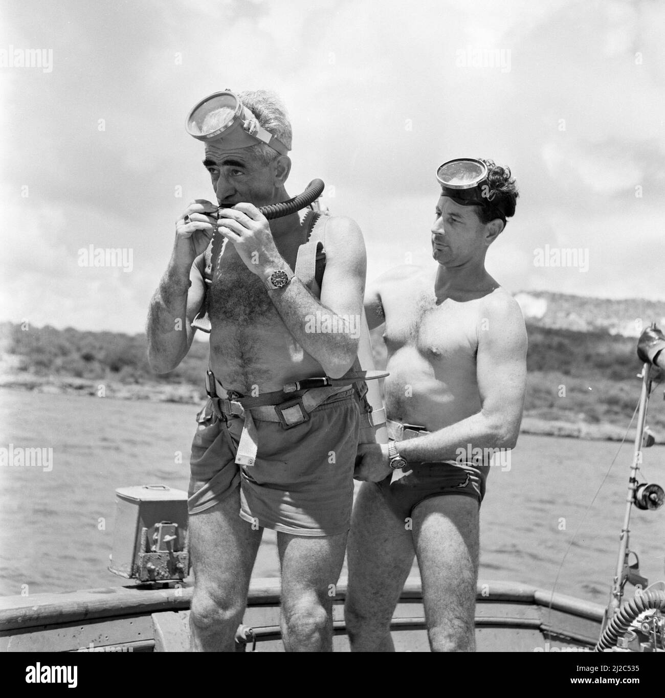 Diver Fischer and another diver on a boat in the Fuikbaai ca. October ...