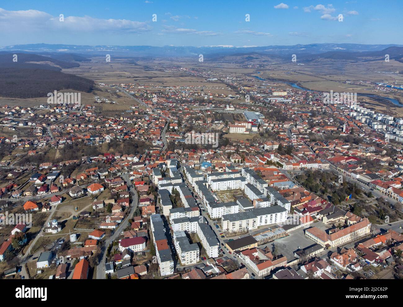 An aerial view of Reghin city with many buildings in Romania Stock ...