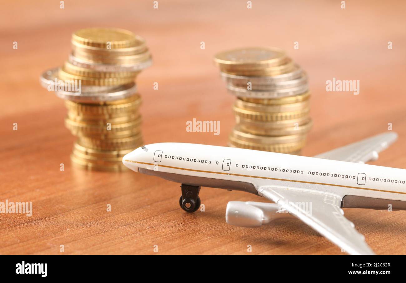A plane with money- concept the airlines business Stock Photo - Alamy