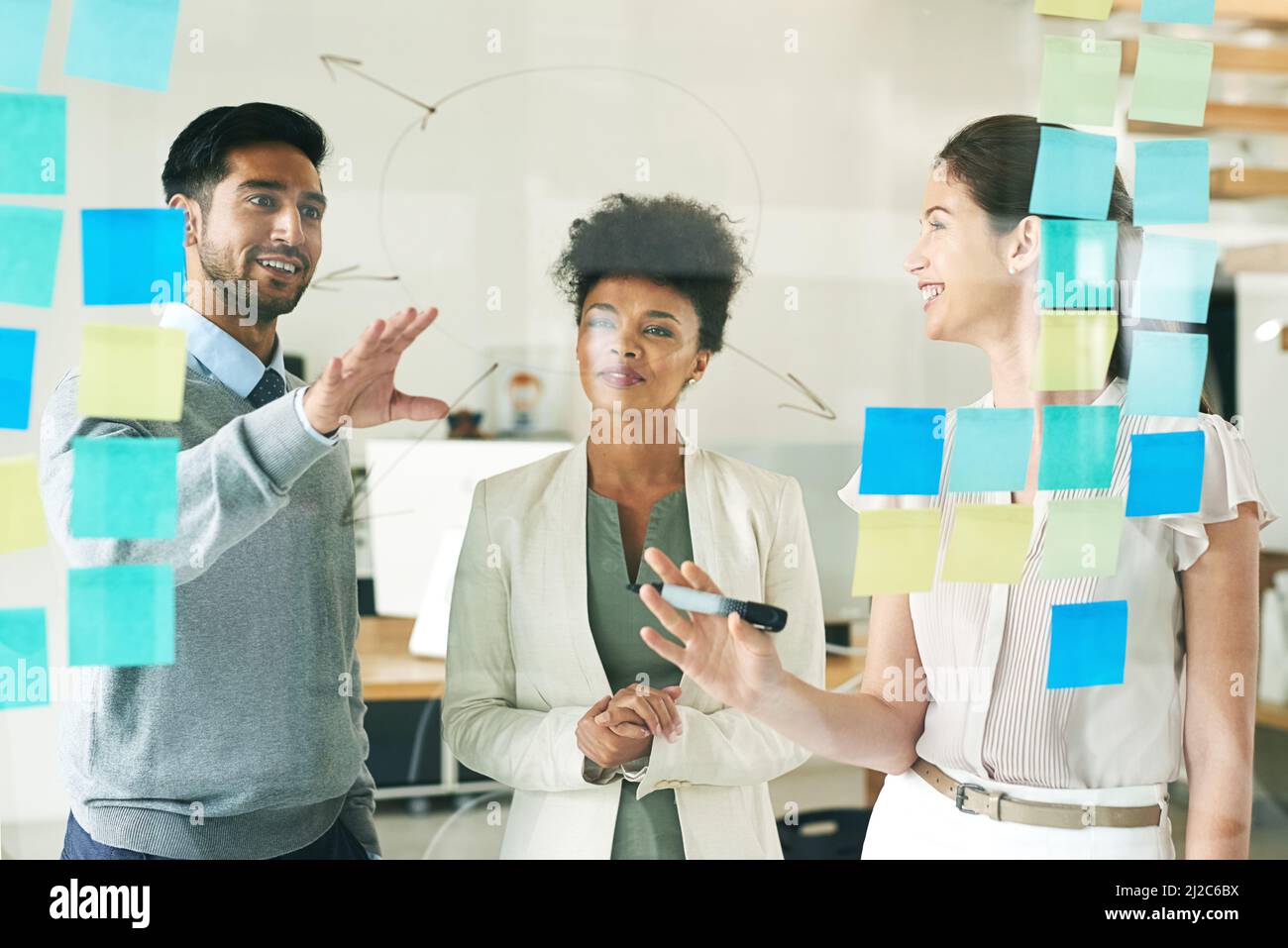 Brainstorming brilliant ideas. Shot of a group of young colleagues ...