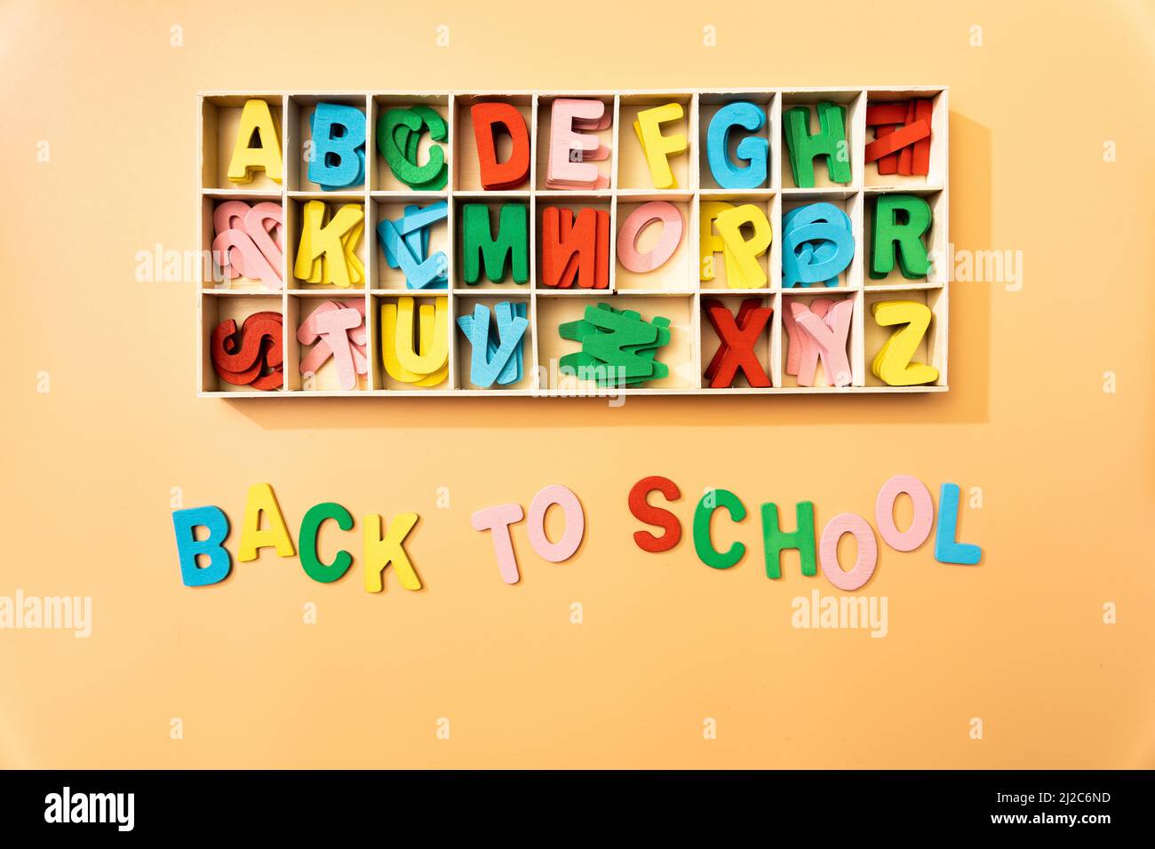 Back to school represented as a concept by wooden color letters over a ...