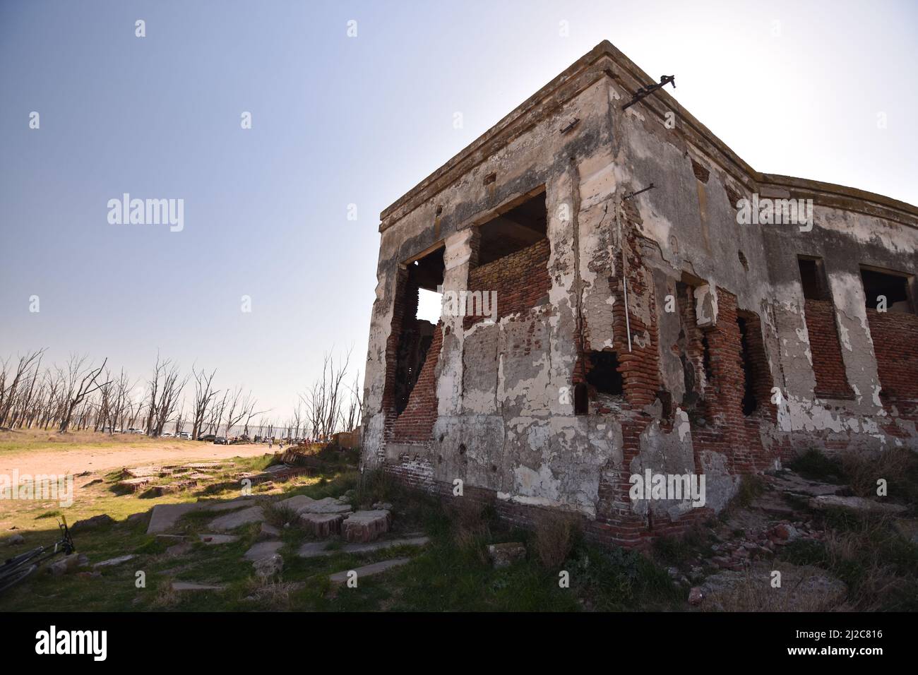 The blue sky over collapsed Slaughterhouse in Villa Epecuen on a sunny ...