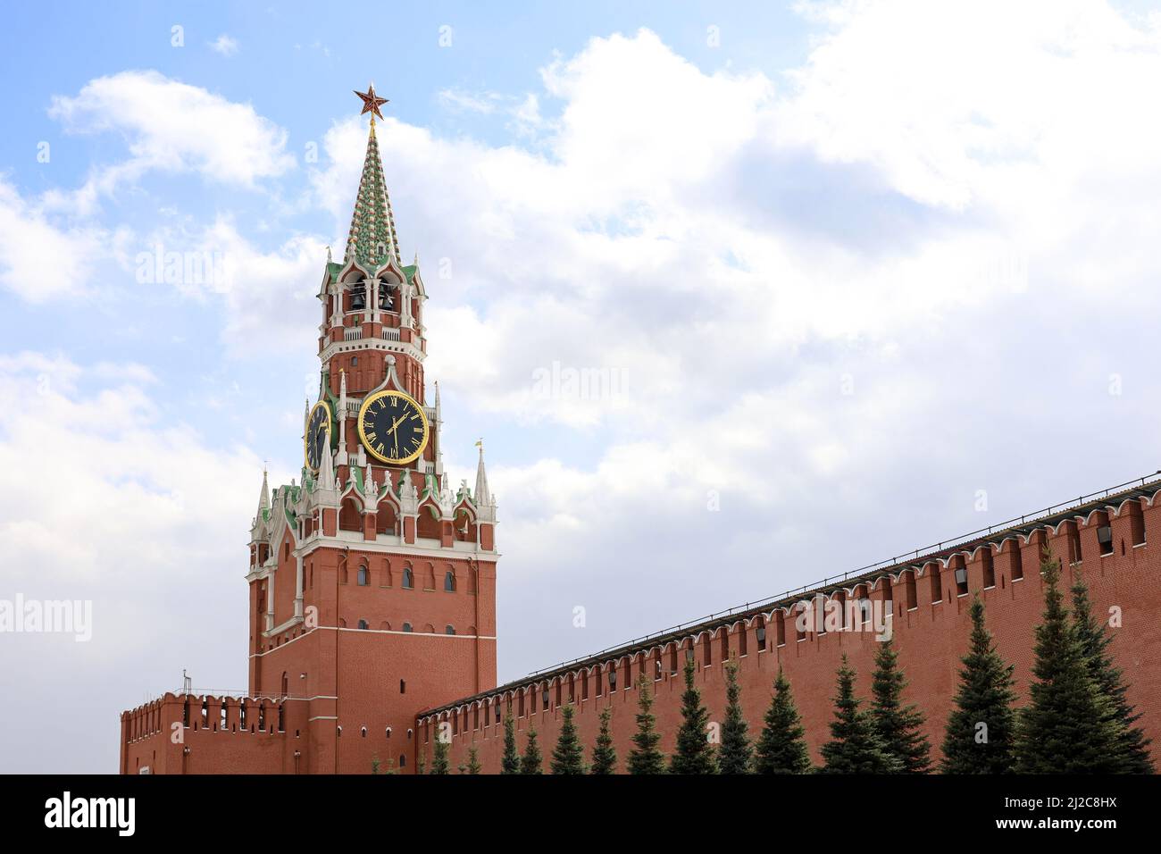 Red square in Moscow with Kremlin tower, chimes and brick wall on ...