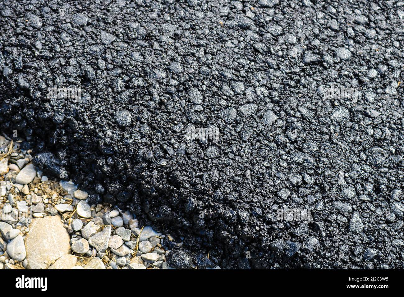 New layer of asphalt road under construction Stock Photo - Alamy