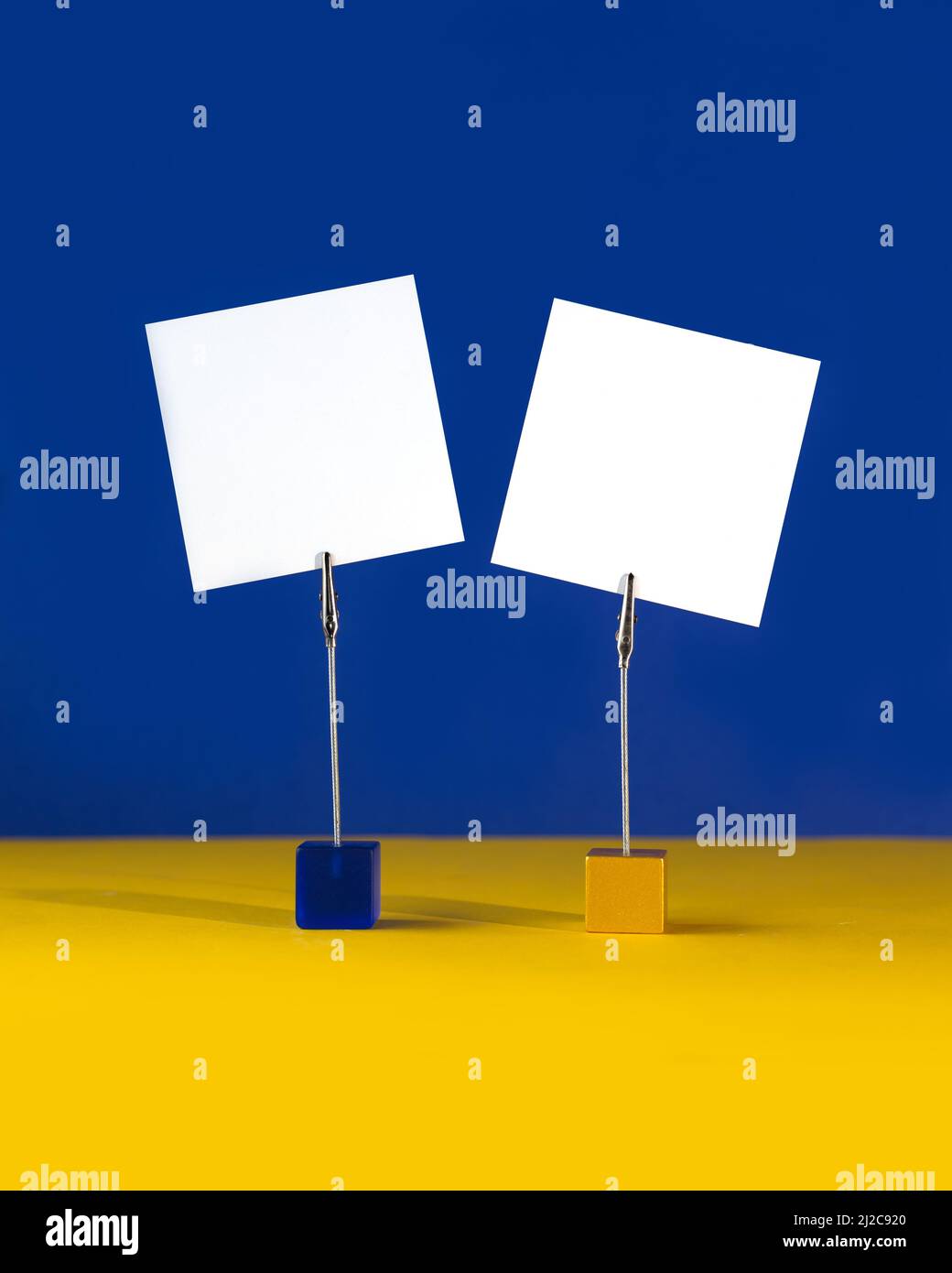 Memo note stand holder with clip with blank card on blue and yelow ...