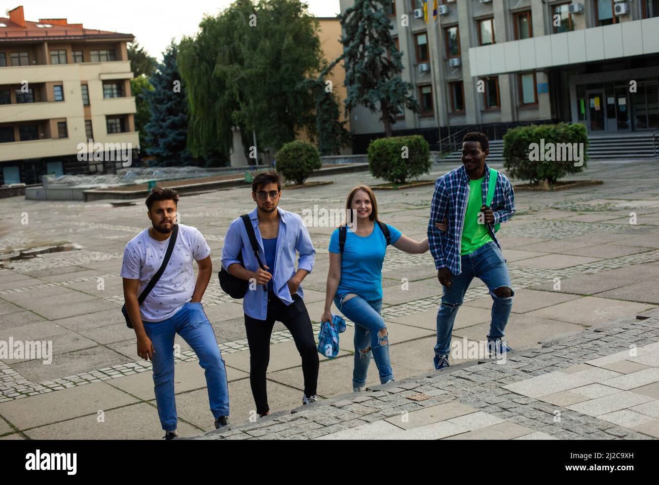 The diverse students leave the university after finish lessons Stock ...