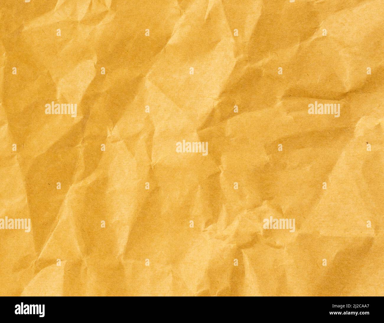 Wrinkled sheet of yellow paper. Textured backdrop Stock Photo - Alamy