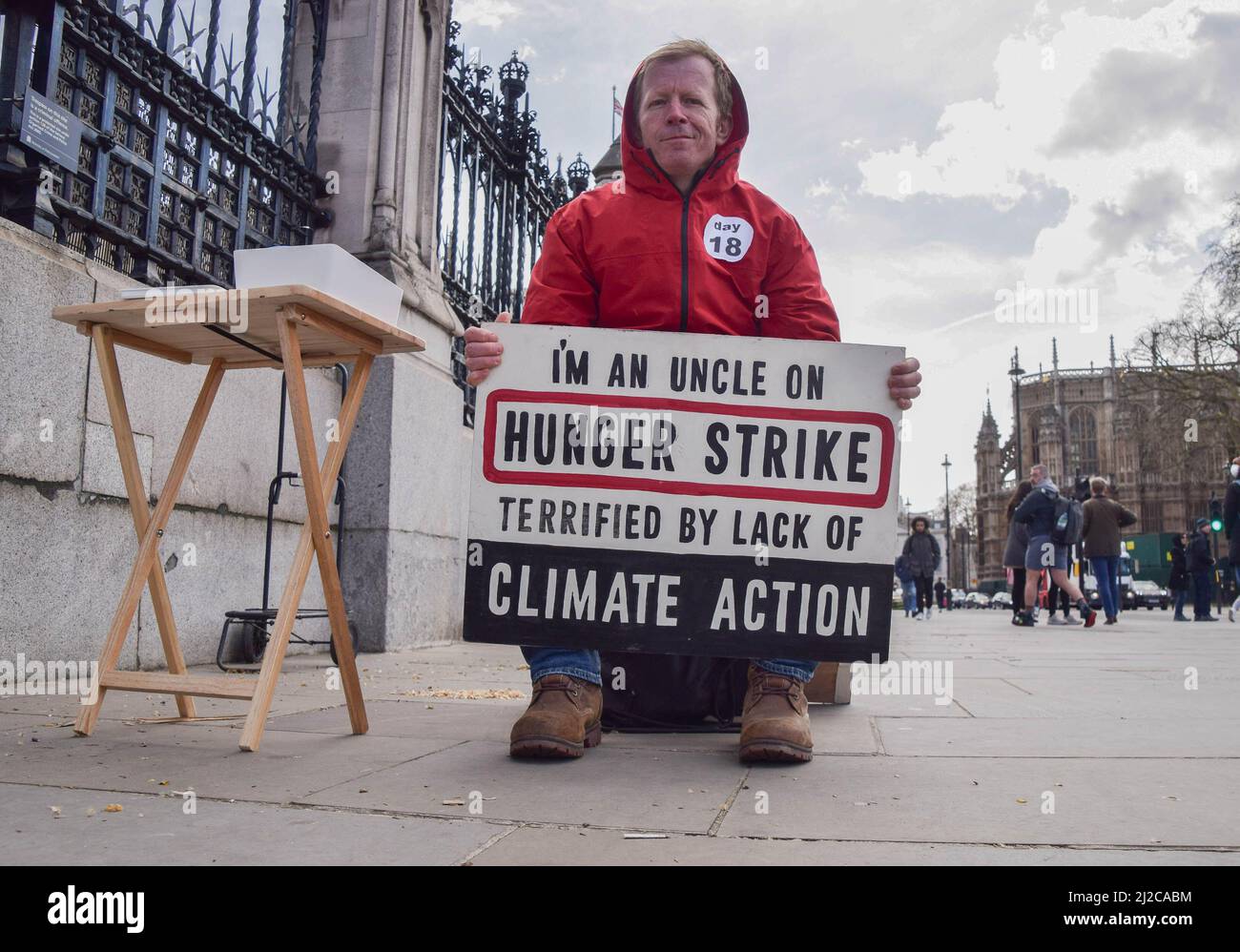 UK. 31st Mar, 2022. Angus Rose seen holding a placard explaining his ...