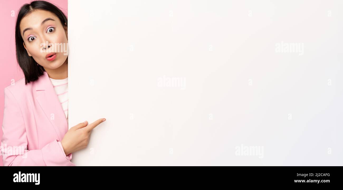 Portrait of young japanese business woman, corporate lady in suit ...