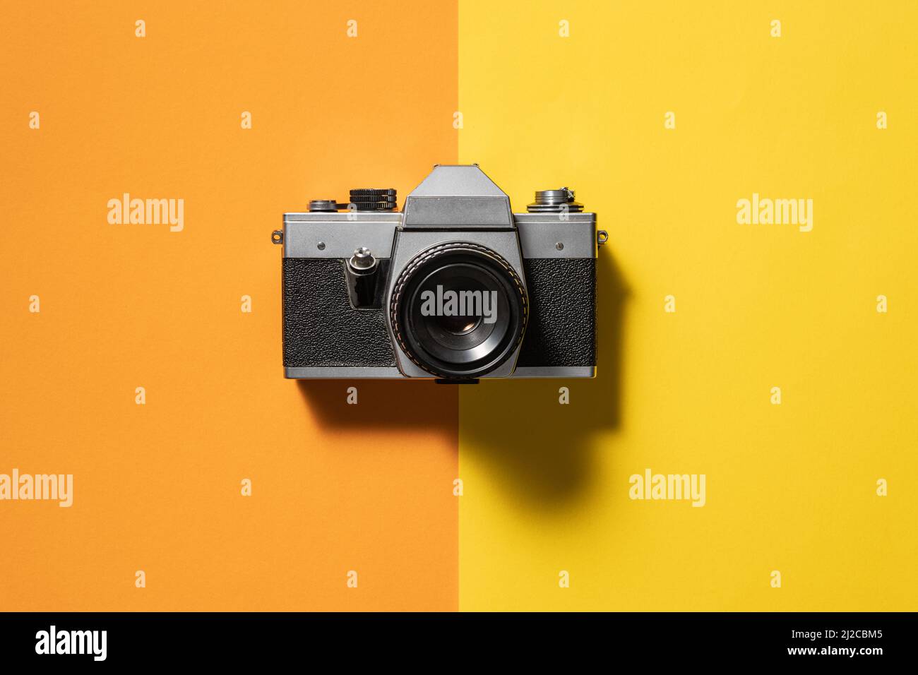 Retro analogue camera. Vintage old fashioned camera with lens on two ...