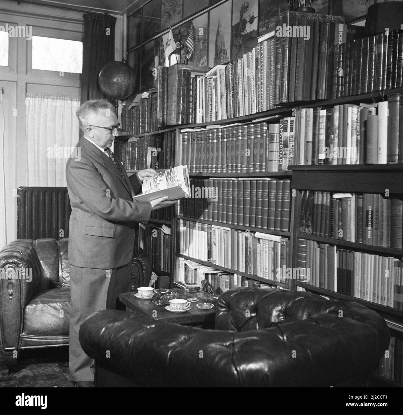 The director of Schiphol Airport, Jan Dellaert, at his bookcase in his ...