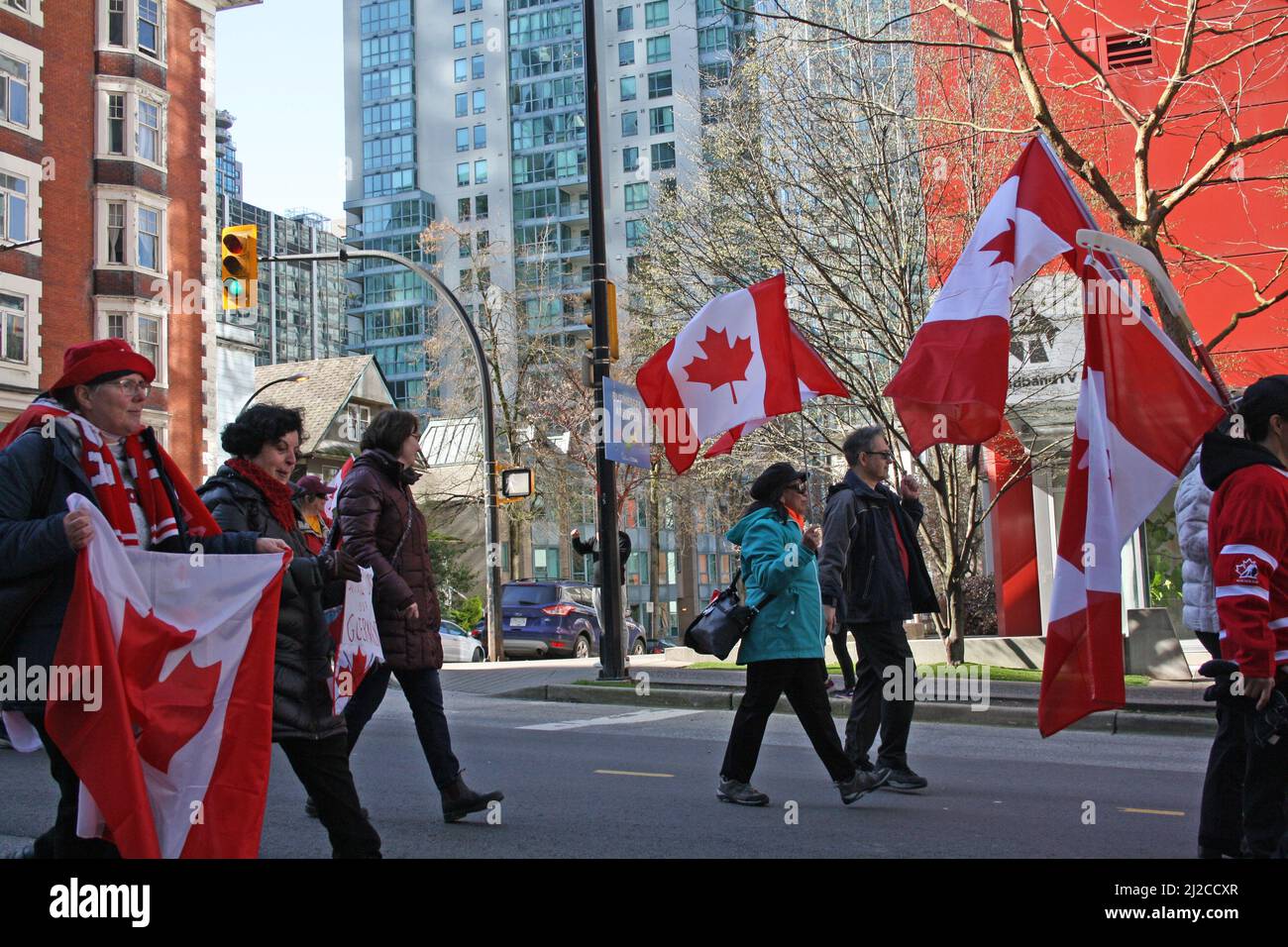 The Protestors with Canadian flags and slogans in the street of ...