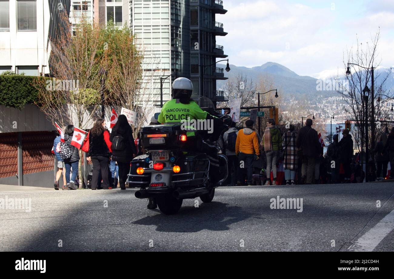 A Police officer riding a motorcycle in downtown Vancouver, british ...