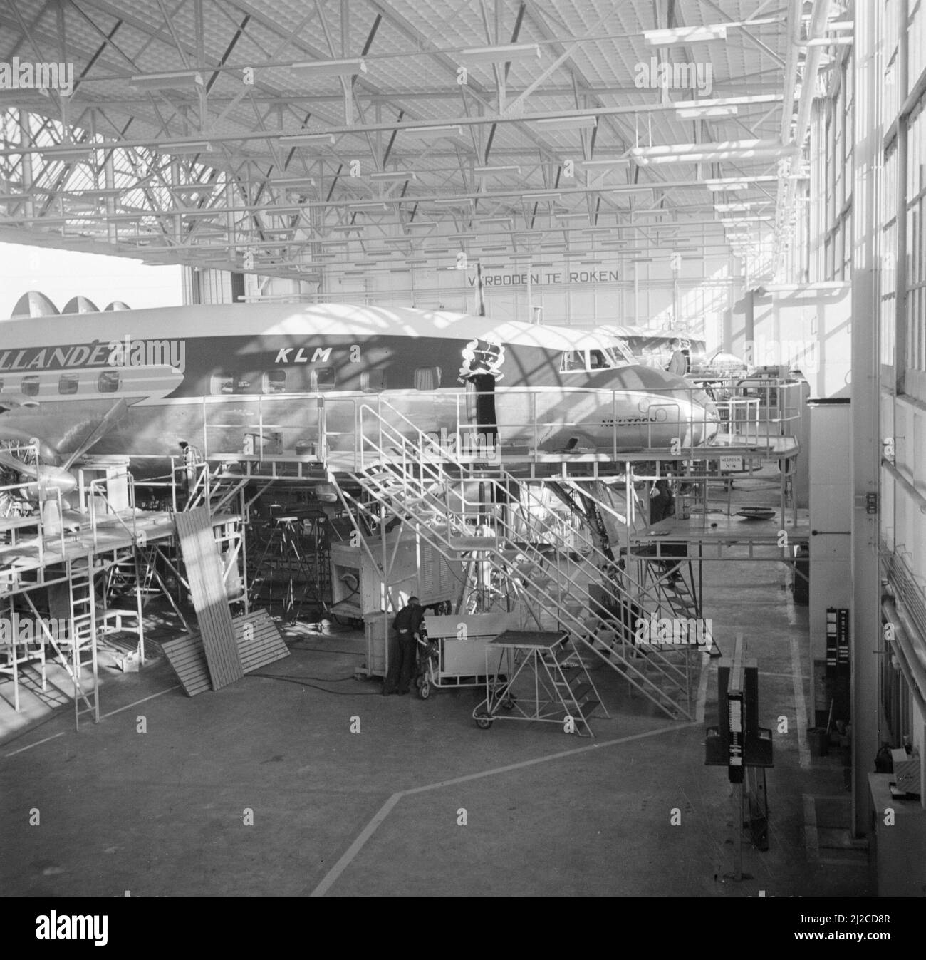 Airplane inside an airplane hangar at an airport in the 1950s Stock ...
