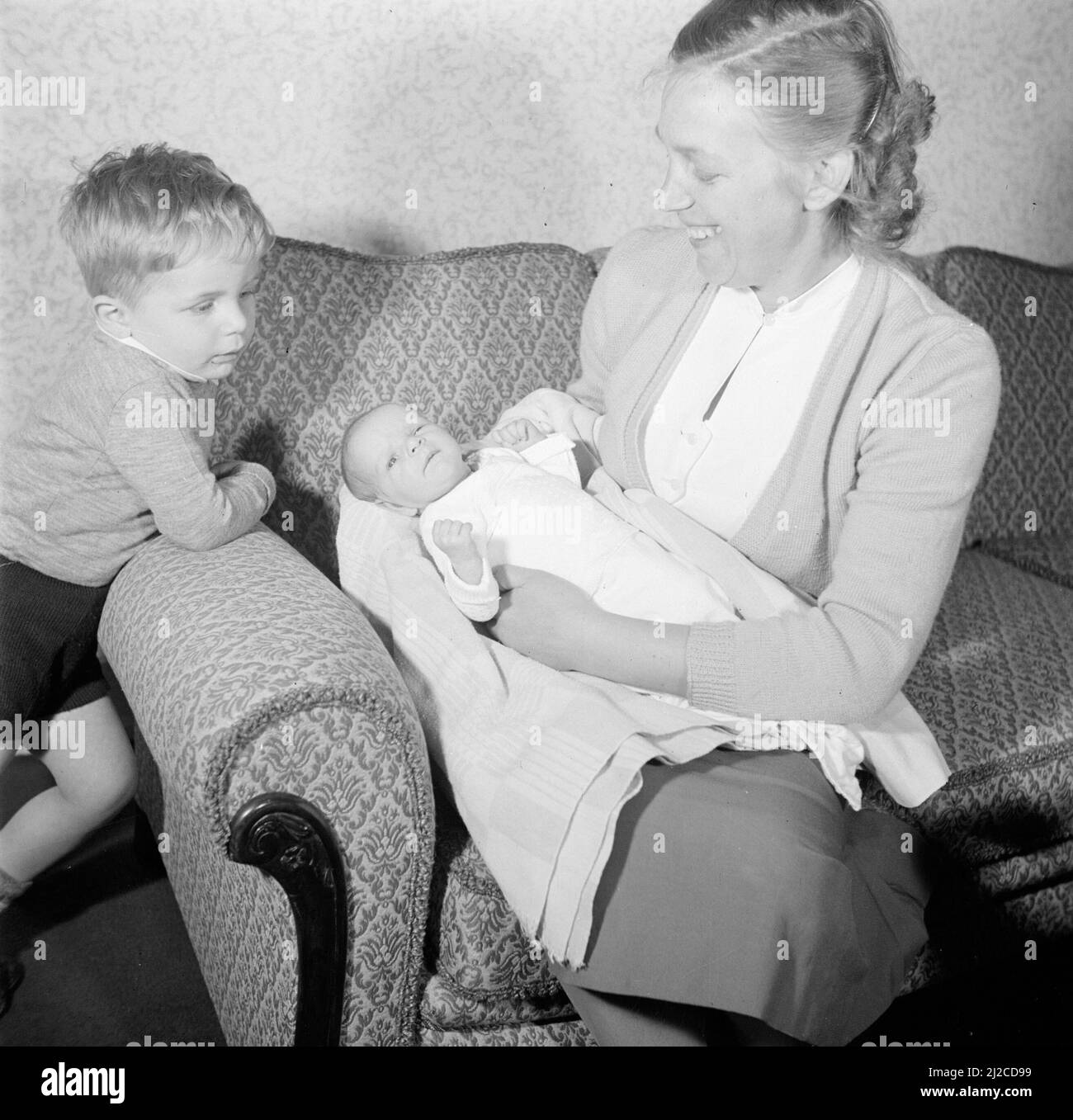 Mrs. Rietveld with baby and child ca: May 1954 Stock Photo - Alamy