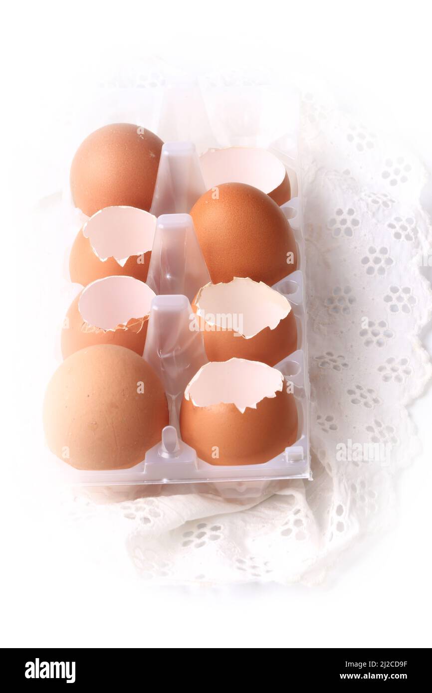 chicken eggs shells on white lace background Stock Photo - Alamy