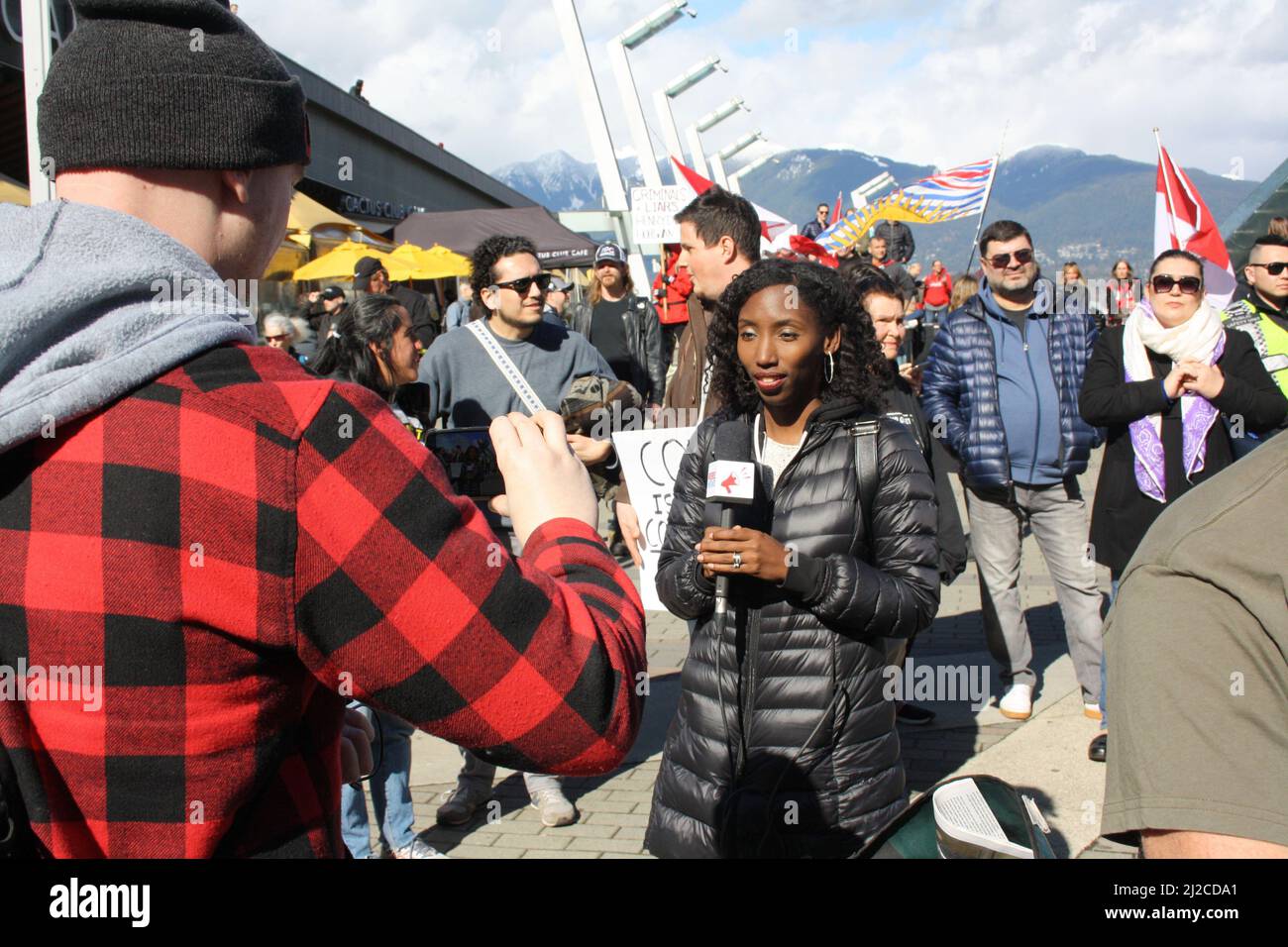 A group of Protestors with flags and slogans in downtown Vancouver ...