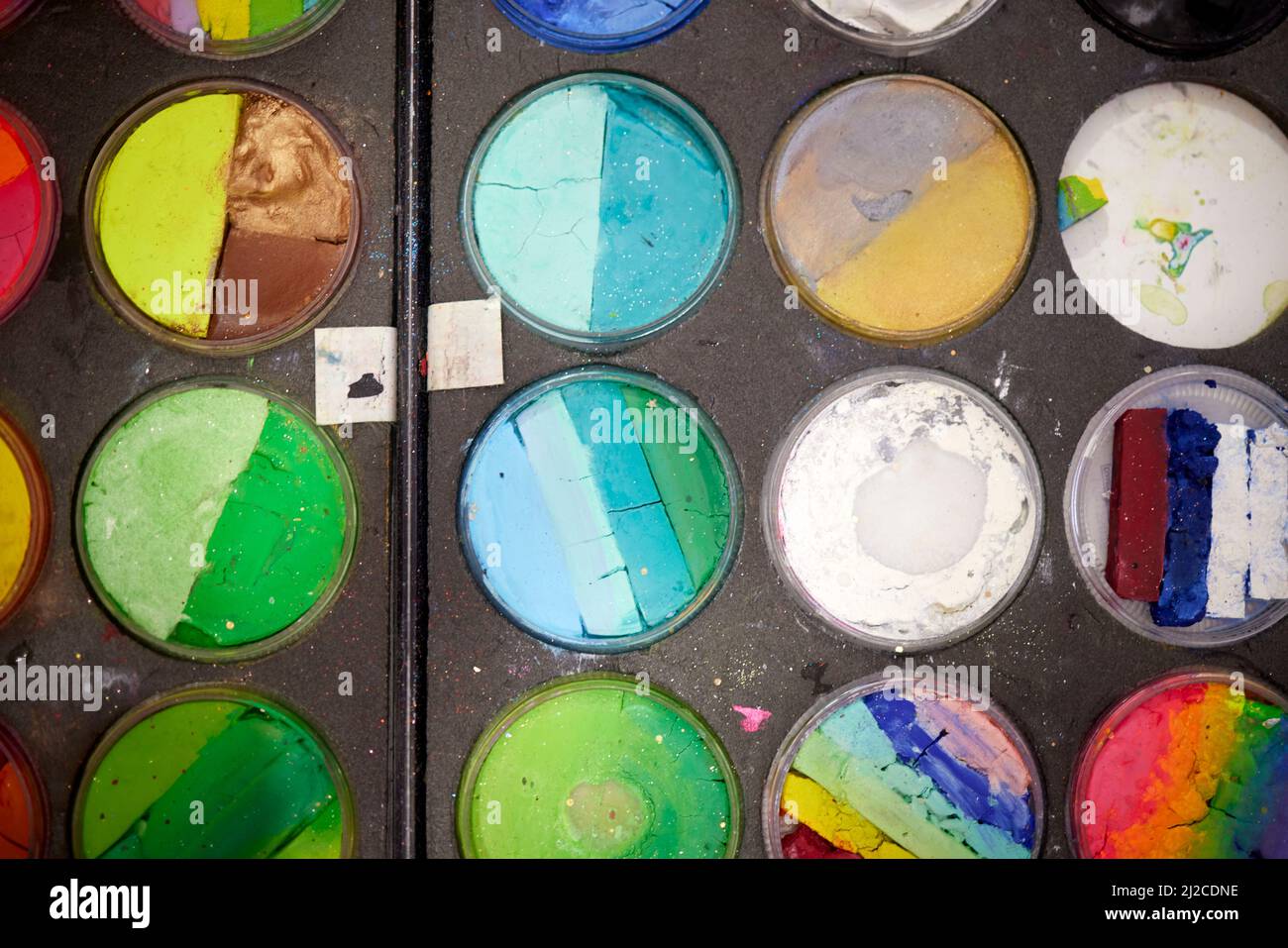 Colorful paint tubes on a table with paints used for face art Stock ...