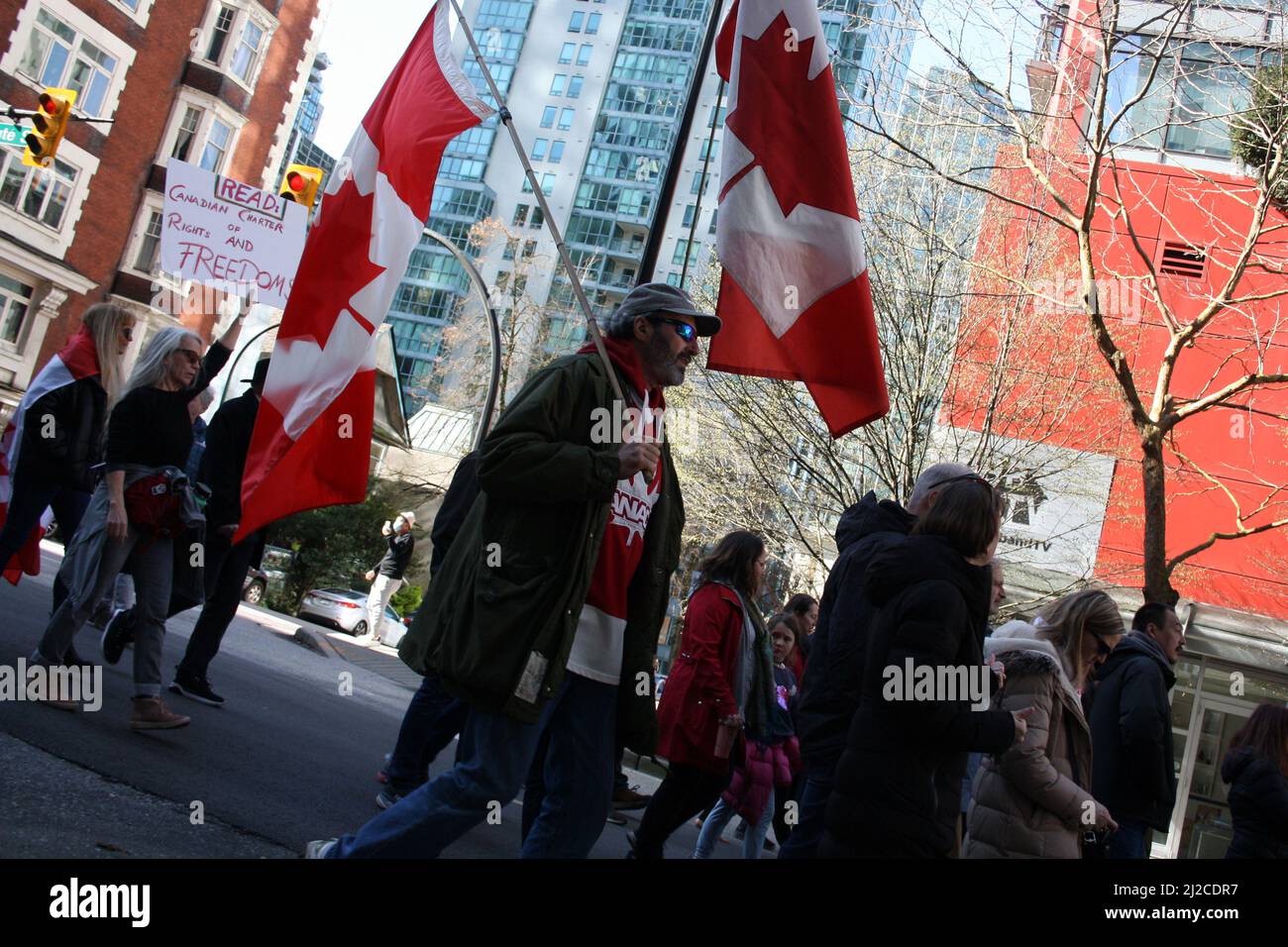 The Protestors with Canadian flags and slogans in the street of ...