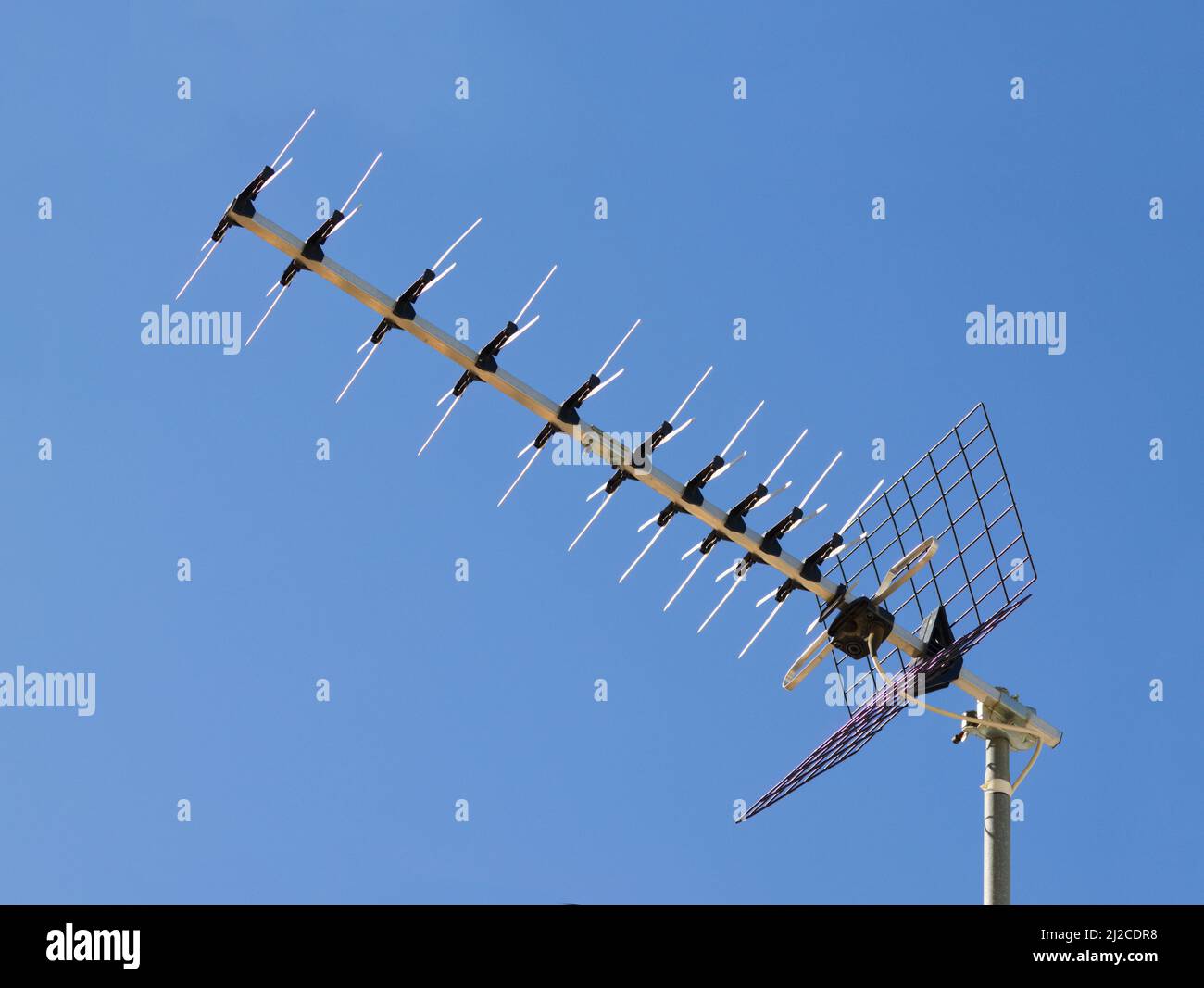 Close-up of an outdoor amplified Yagi-type tdt television antenna with ...